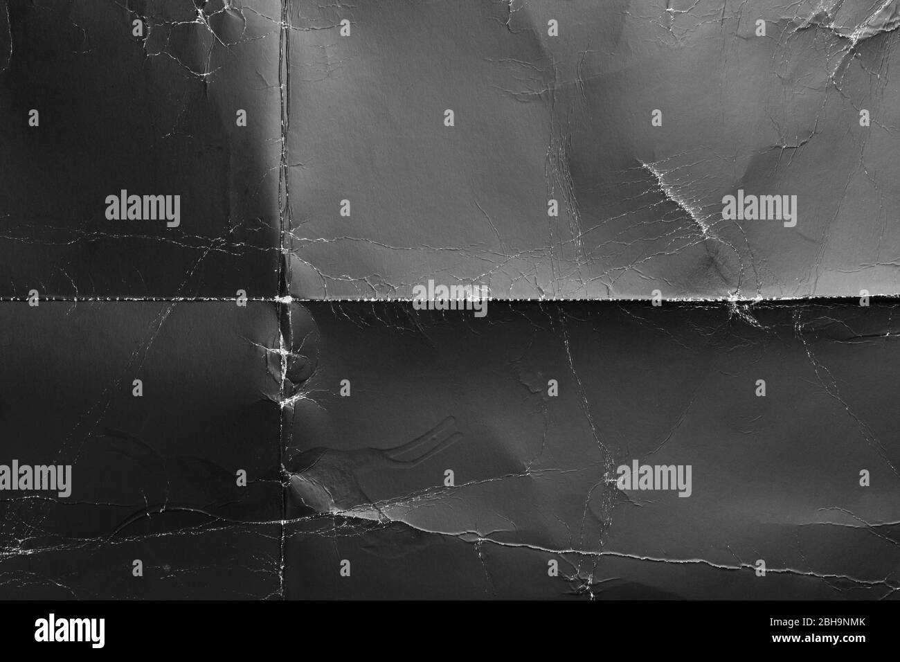 Wrinkled black old paper with frayed wrinkles and a contrasting texture ...