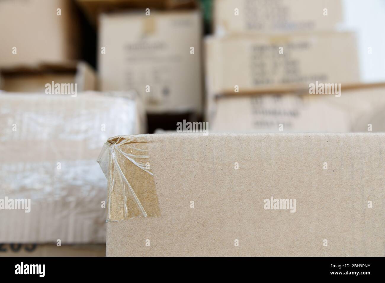 Pile of brown old used cardboard boxes at warehouse of market Stock ...