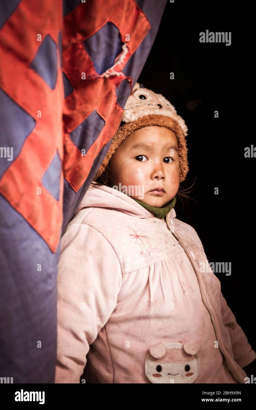 Little girl behind fabric curtain Stock Photo - Alamy
