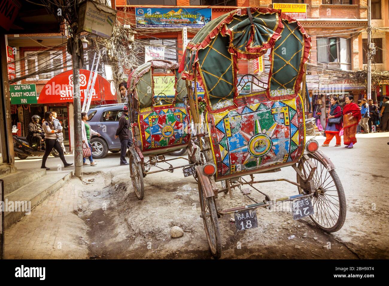 Two colorful rickshaws on the roadside, rickshaw Stock Photo - Alamy