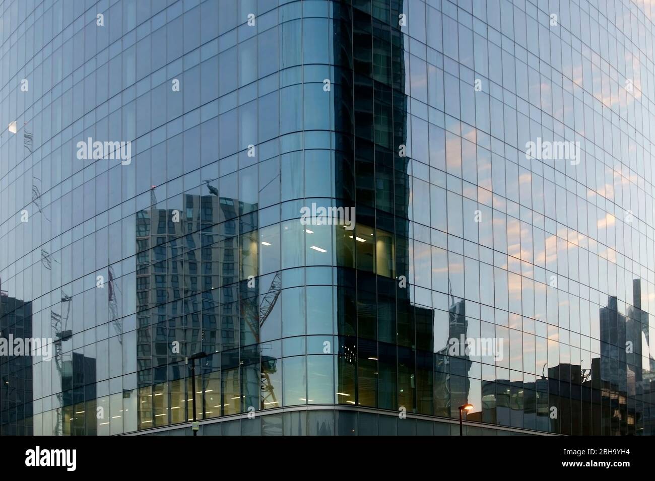 The tinted windows of a skyscraper facade on Fenchurch Street in London ...