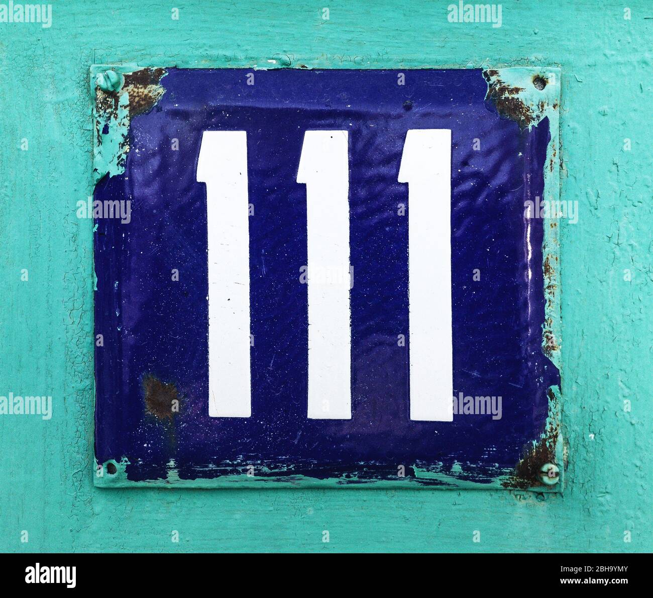 blue painted old adress plate house number 111 Stock Photo - Alamy