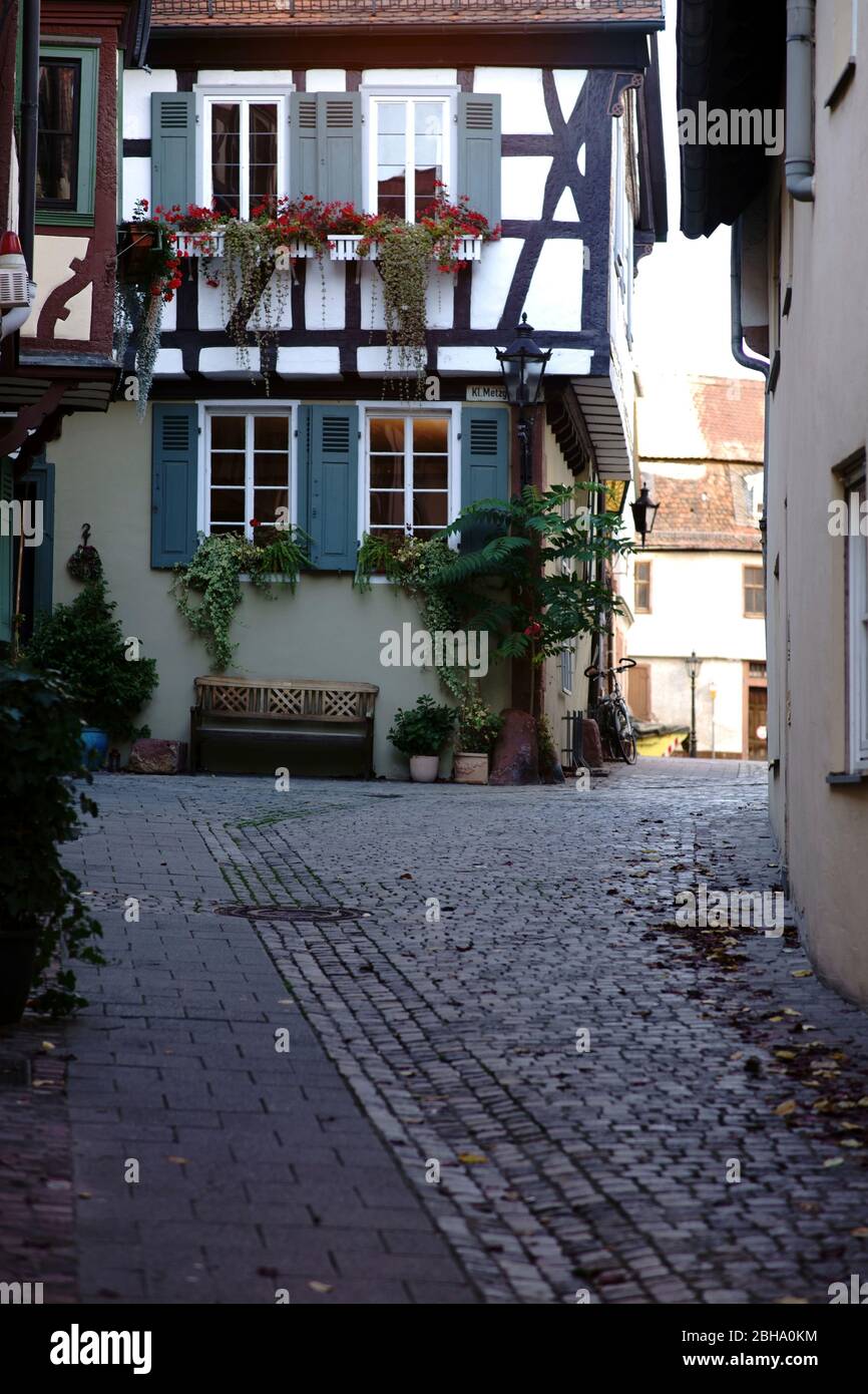A narrow cobbled street in an old town with half-timbered houses Stock ...