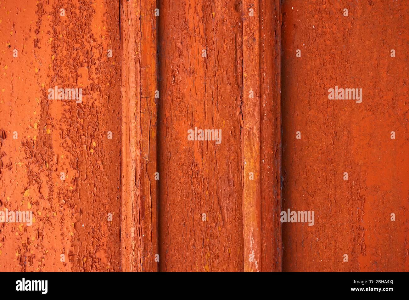 Color on wood chipped and weathered red orange yellow Stock Photo - Alamy