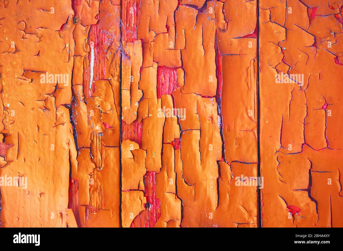 Color on wood chipped and weathered red orange yellow Stock Photo - Alamy