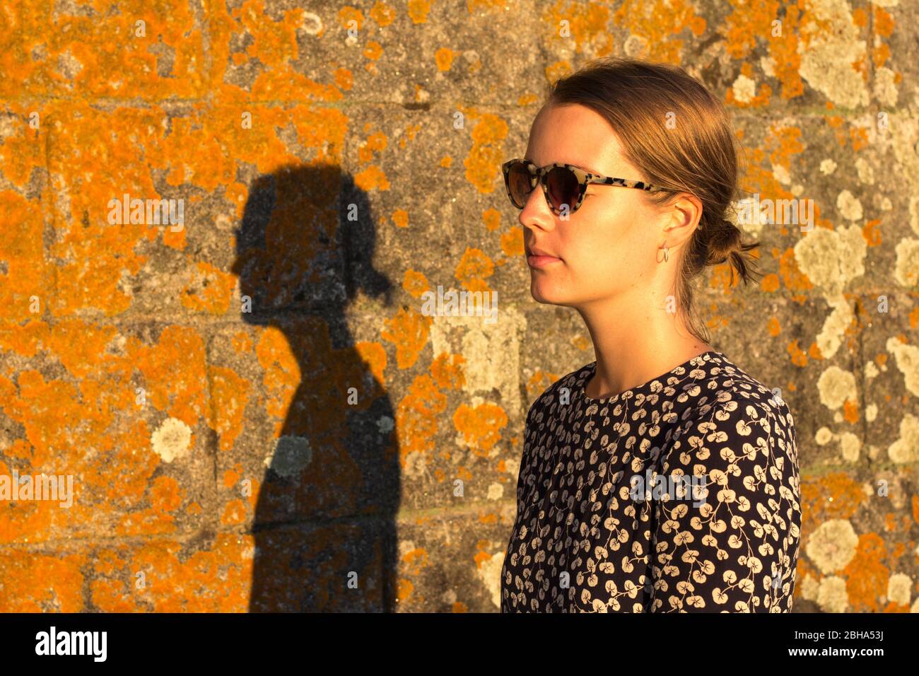 Woman lean against wall hi-res stock photography and images - Alamy