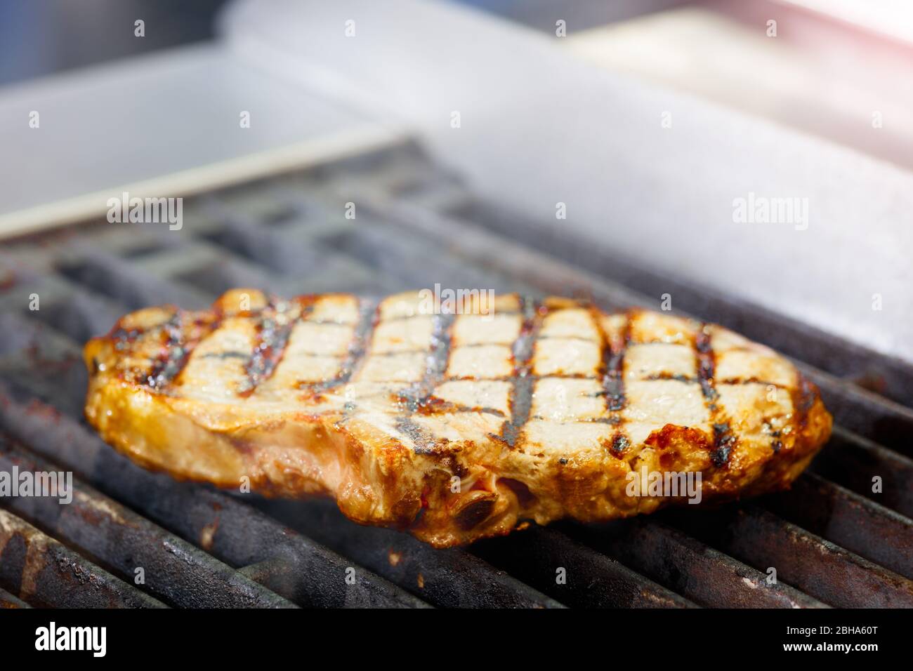 cooking burgers on hot grill with flames Stock Photo - Alamy