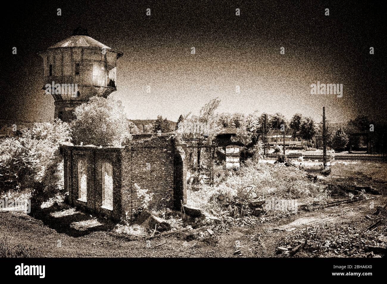 Engine shed remains, water tower, dilapidated Stock Photo - Alamy