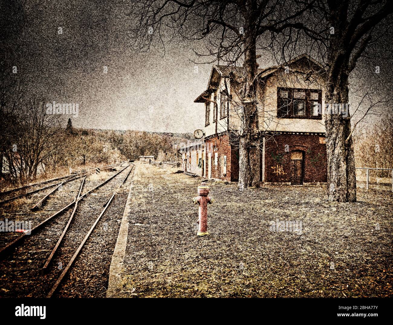 Platform, tracks, broken turnout, trees, buildings, digitally processed ...