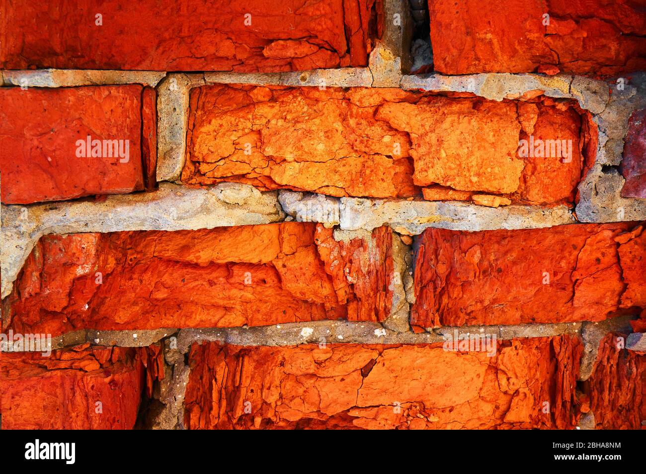 Wall of red brick close-up ruined. Abstract background Stock Photo - Alamy