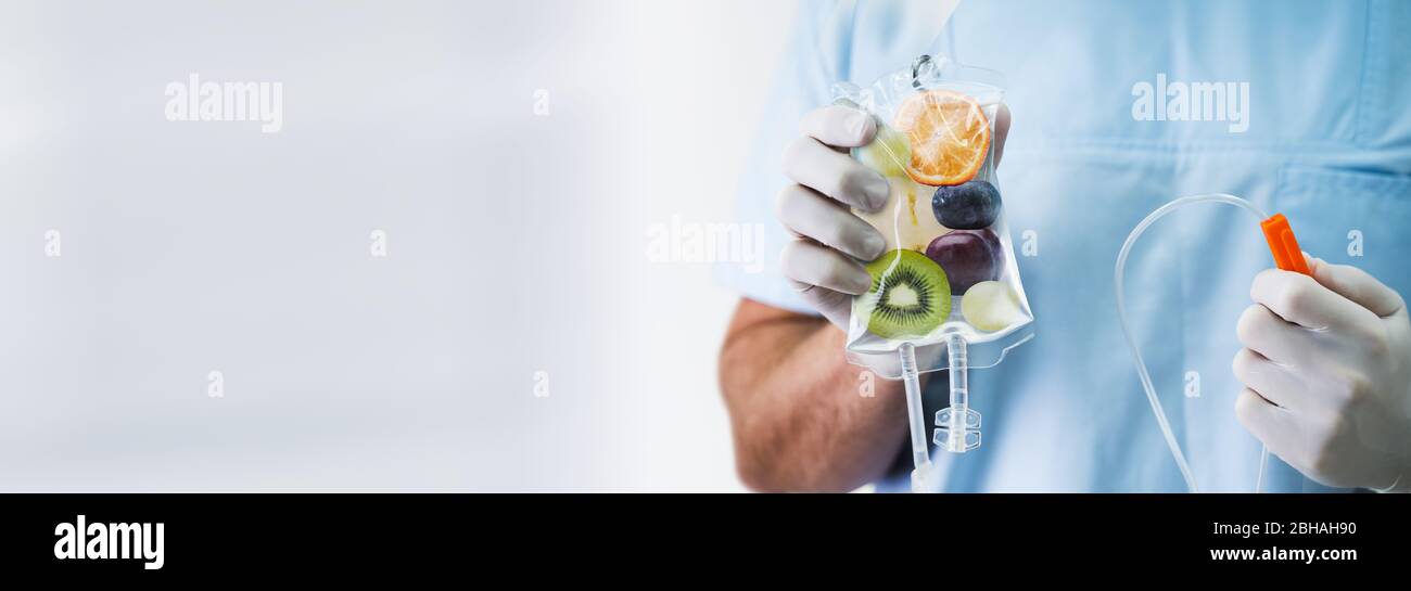 IV Drip Vitamin Infusion Therapy Bag Held By Doctor Stock Photo - Alamy