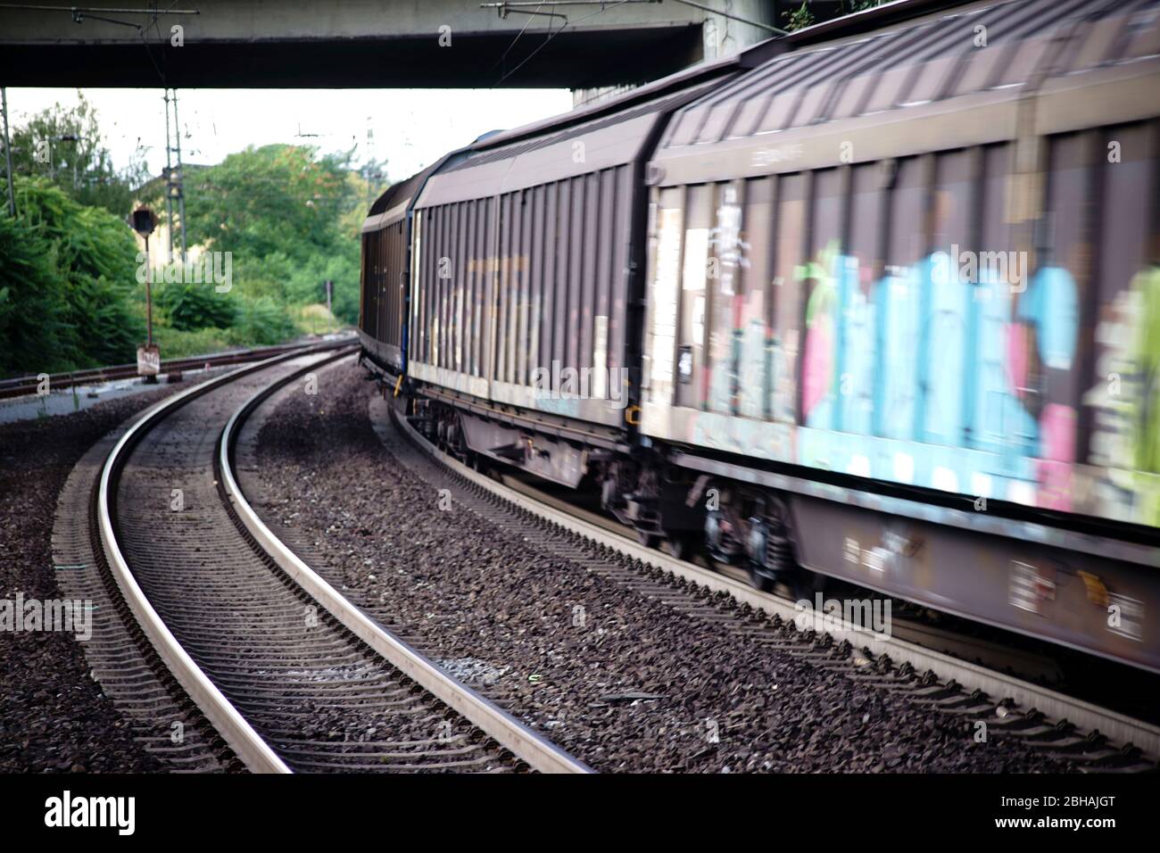 The side view of freight train going into curve hi-res stock ...