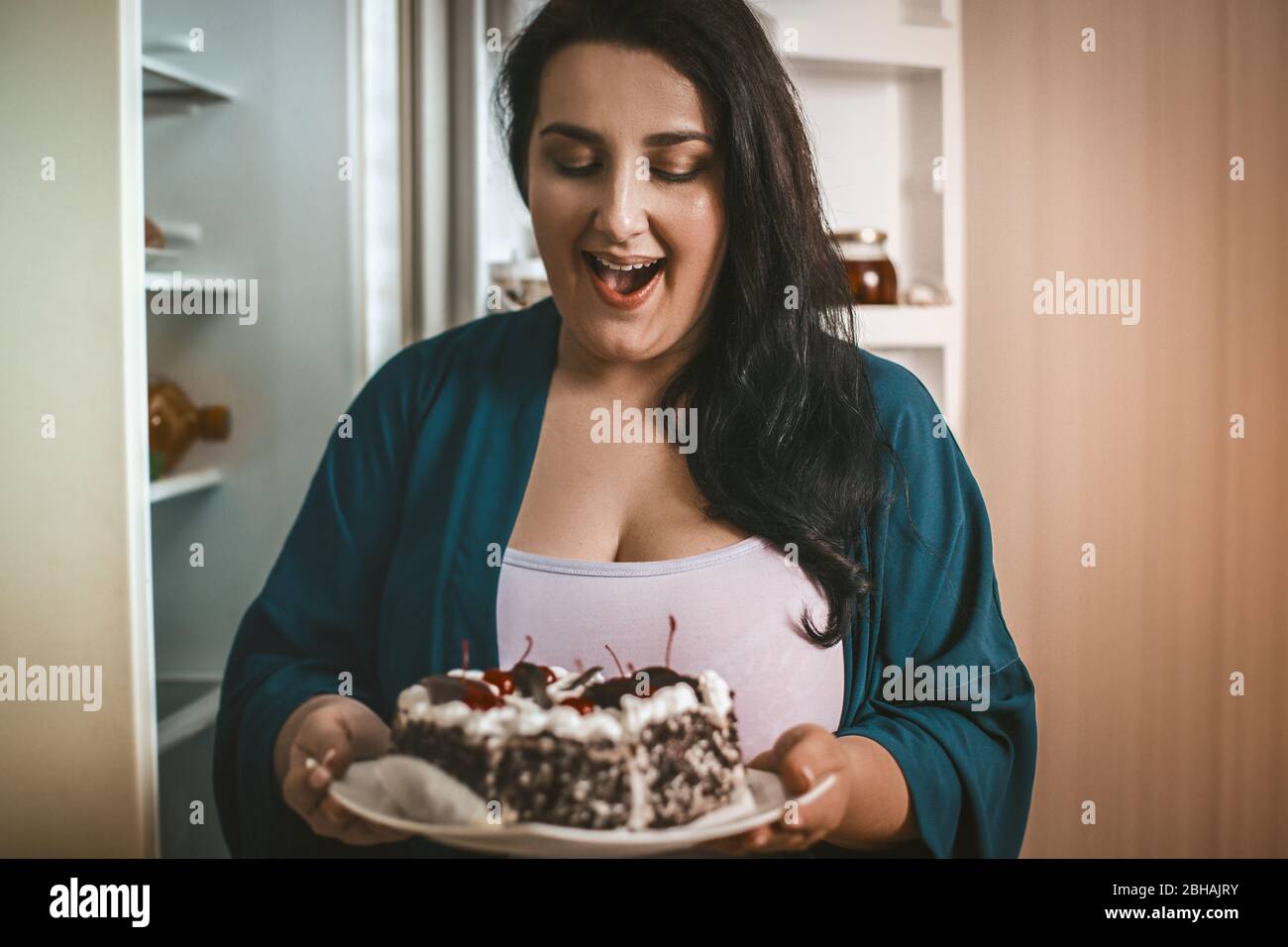 Plus Size Woman Admires Looking At Chocolate Dessert Stock Photo - Alamy
