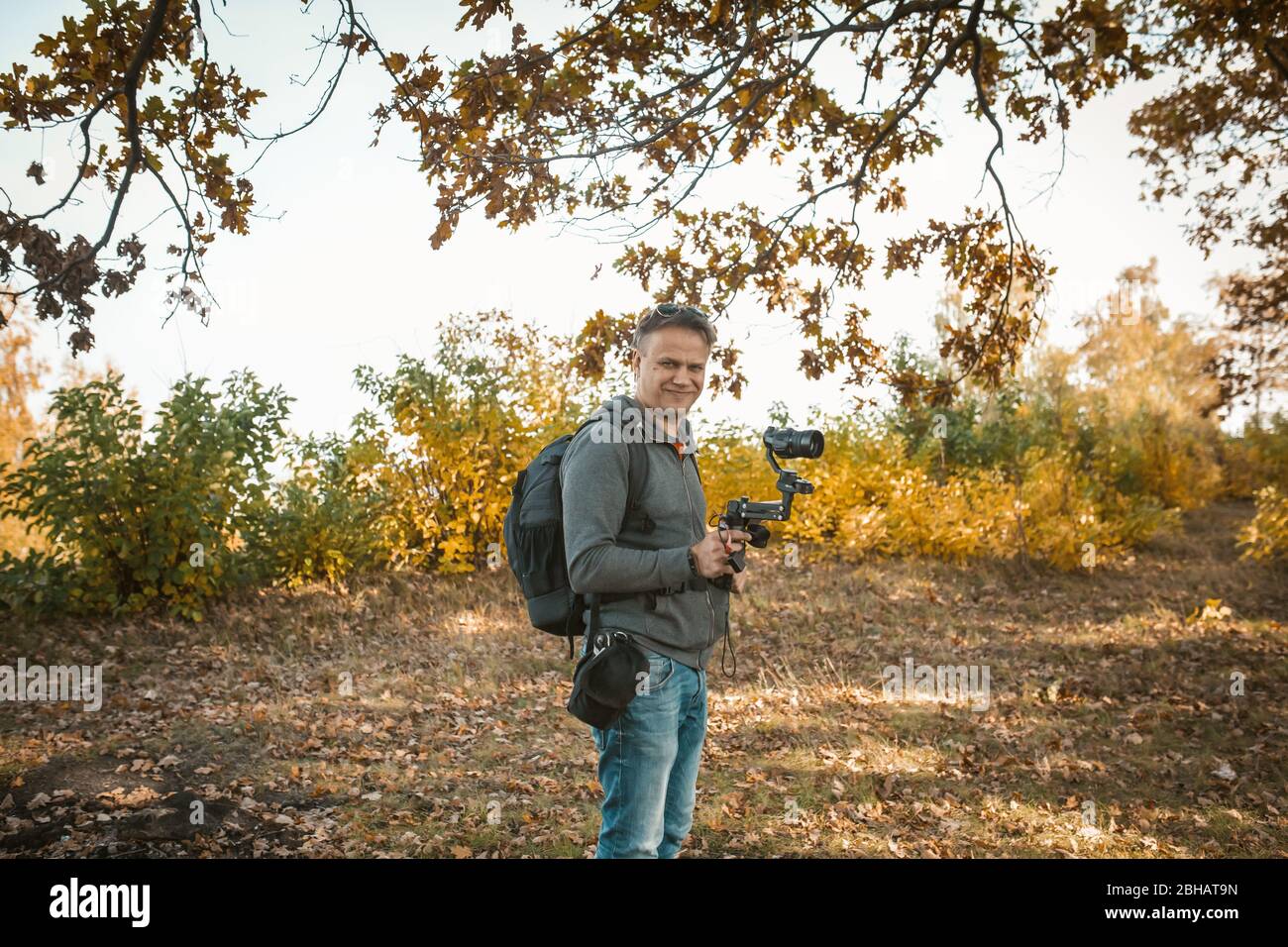 Man holding camera filming hi-res stock photography and images - Alamy