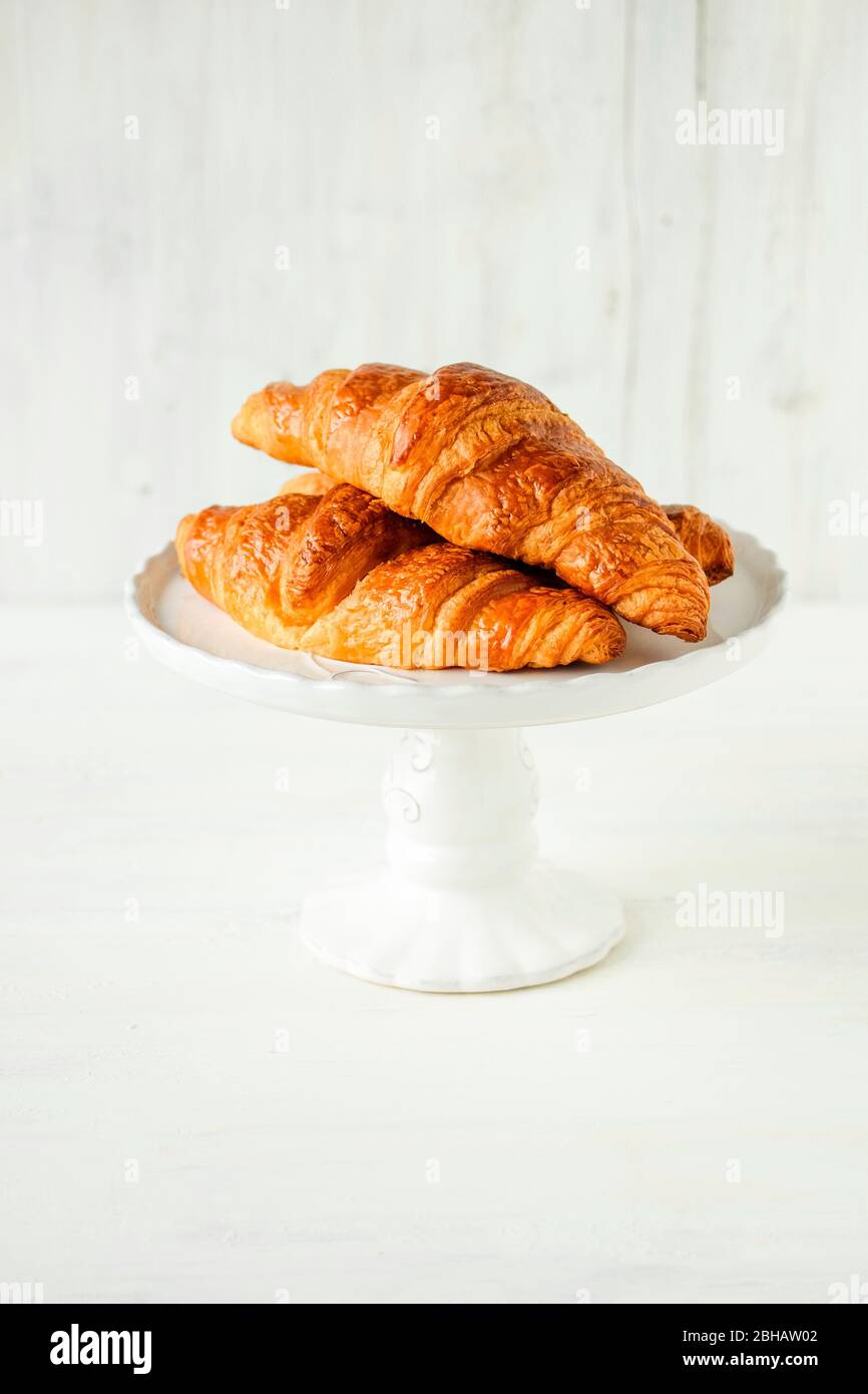 White cake stand with fresh croissants Stock Photo - Alamy