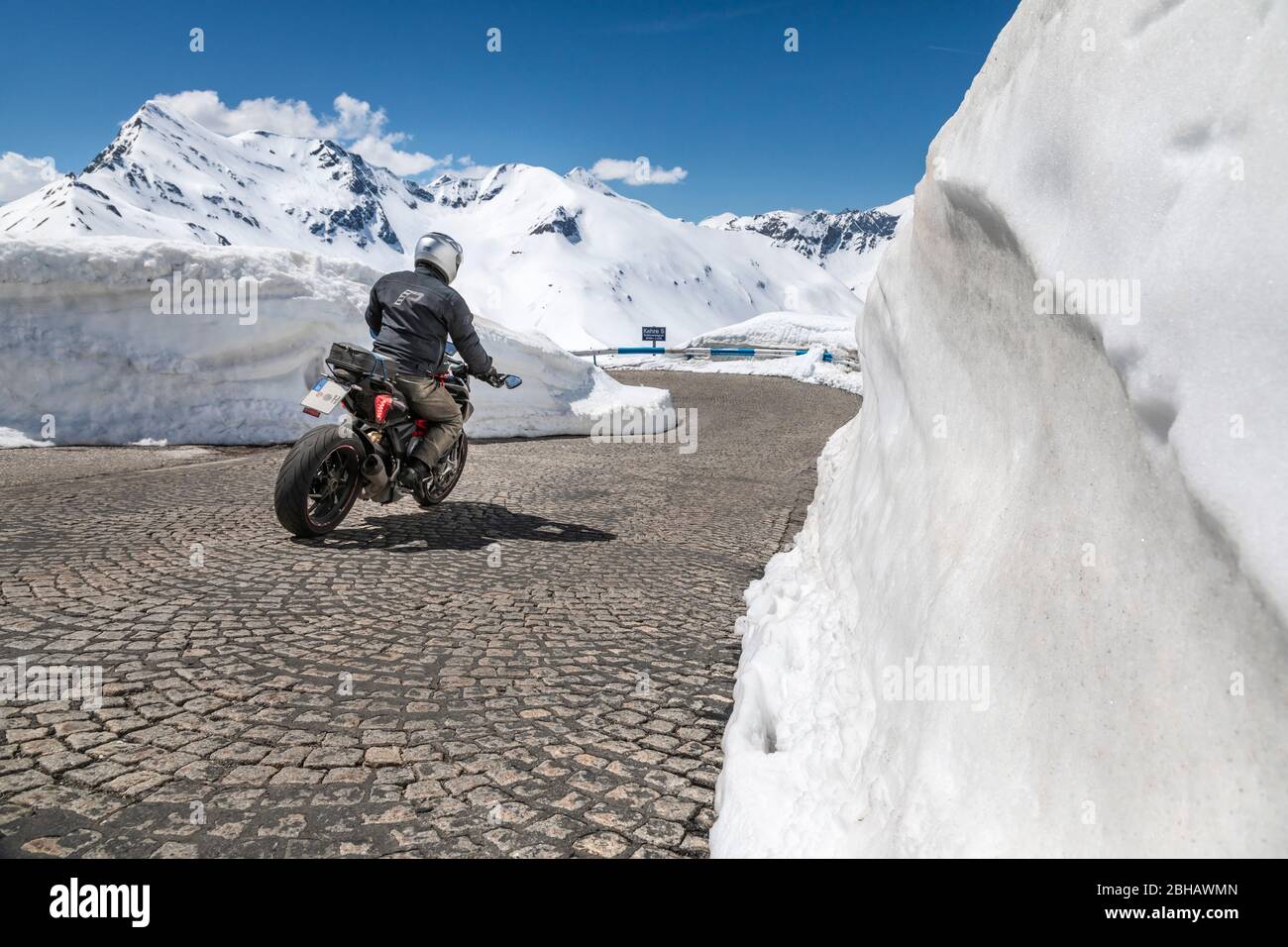 Motorbike at the hairpin bend 5 of the the edelweiss spitze with a lot ...