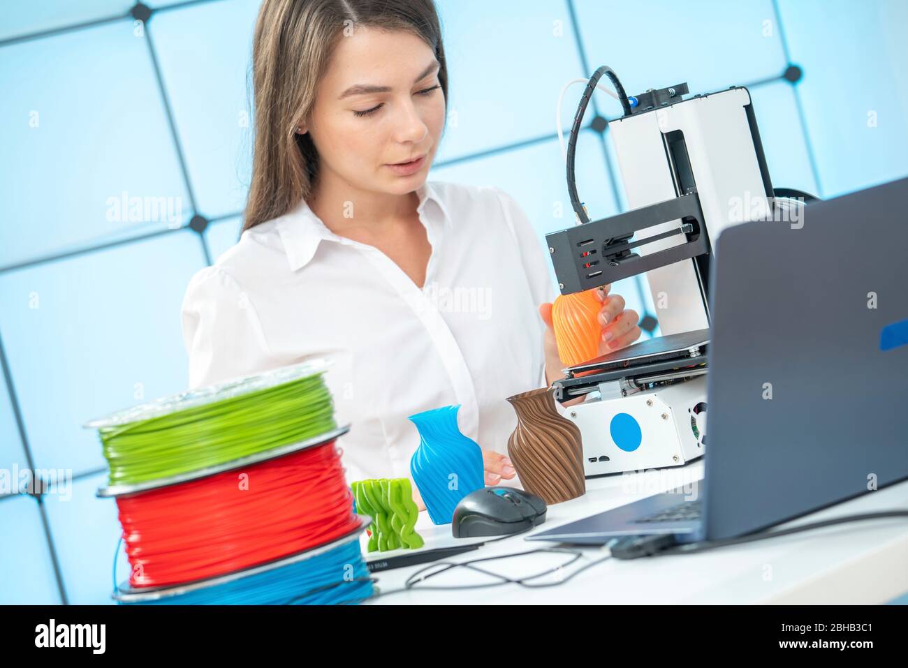 Woman using 3d printer Stock Photo - Alamy