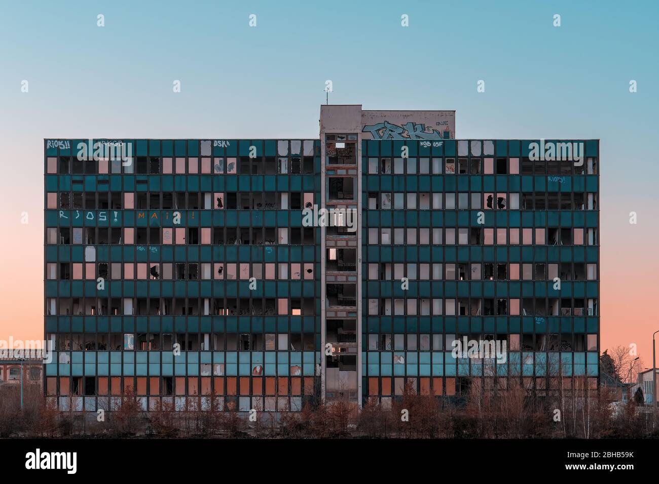 Abandoned building with broken windows and graffiti tags Stock Photo ...