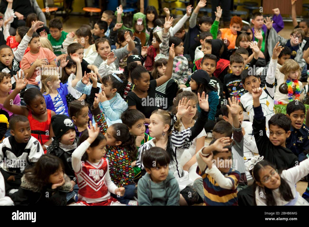 Children audience raising hands hi-res stock photography and images - Alamy
