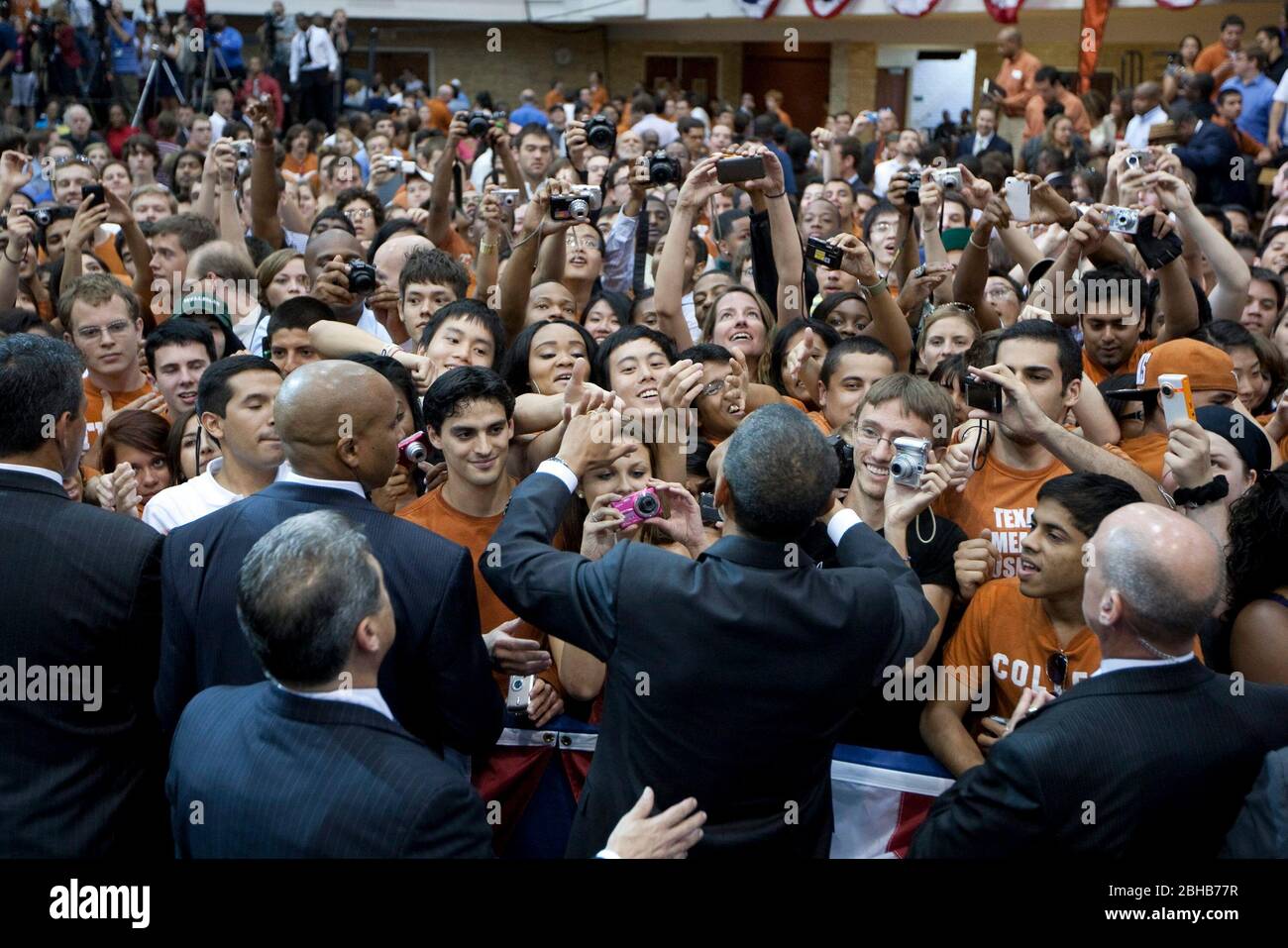 Austin Texas USA, August 9 2010: Excited audience members jostle for a ...