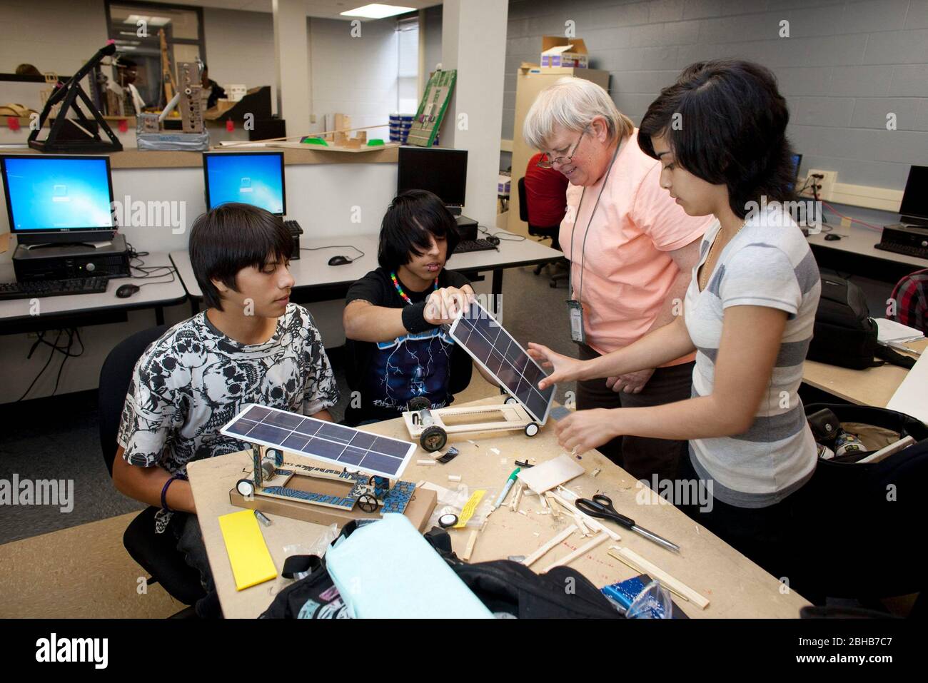Manor Texas USA, May 12 2010: Female science teacher looks on as ...