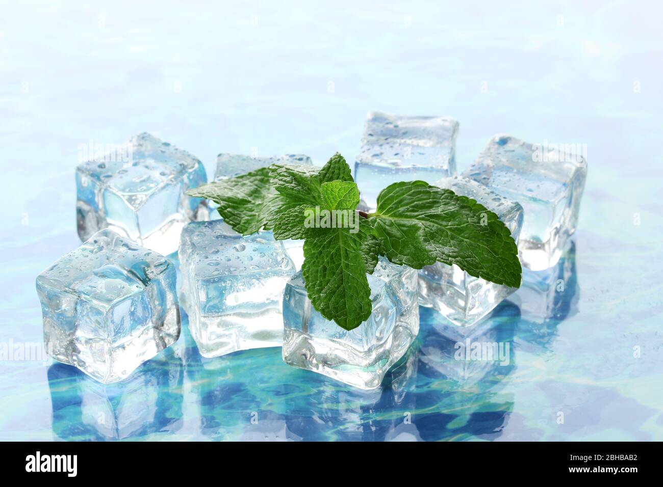 Ice with mint on light background Stock Photo - Alamy