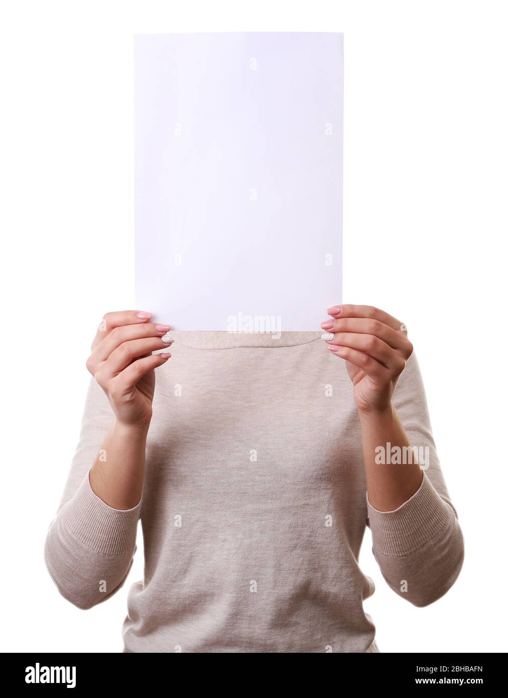 Woman covering her face with blank sheet of paper isolated on white ...