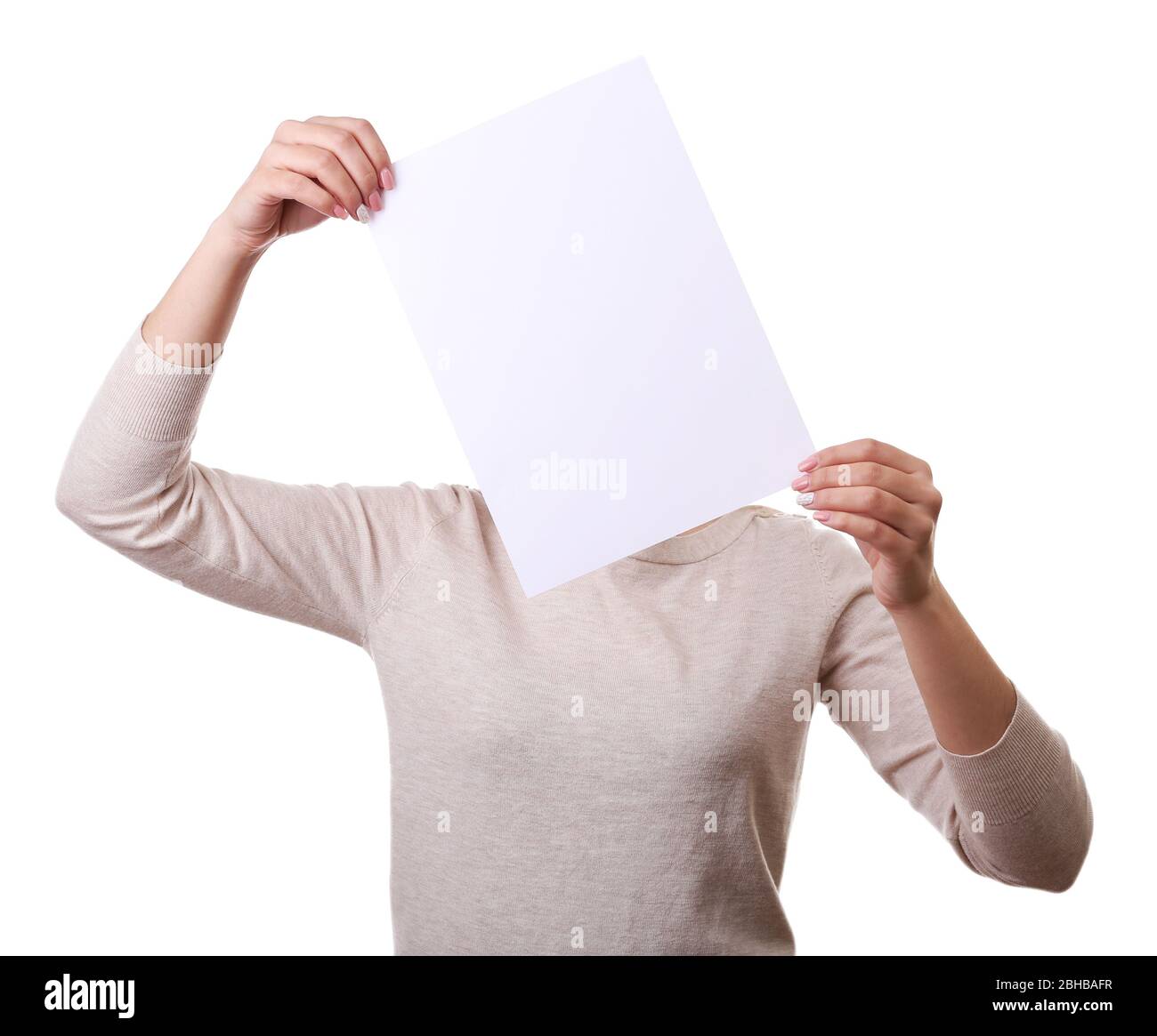 Woman covering her face with blank sheet of paper isolated on white ...