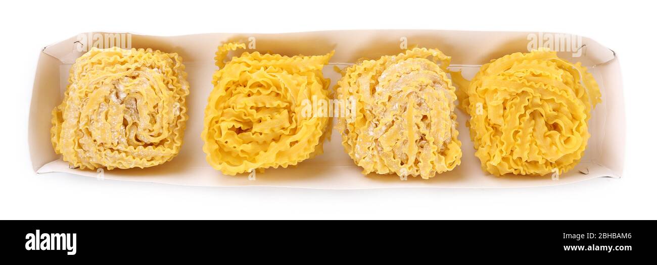 Packaged pasta tagliatelle nests isolated on white Stock Photo - Alamy