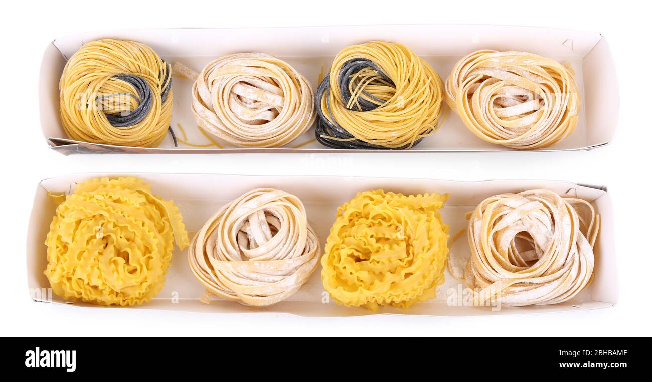 Packaged pasta tagliatelle nests isolated on white Stock Photo - Alamy