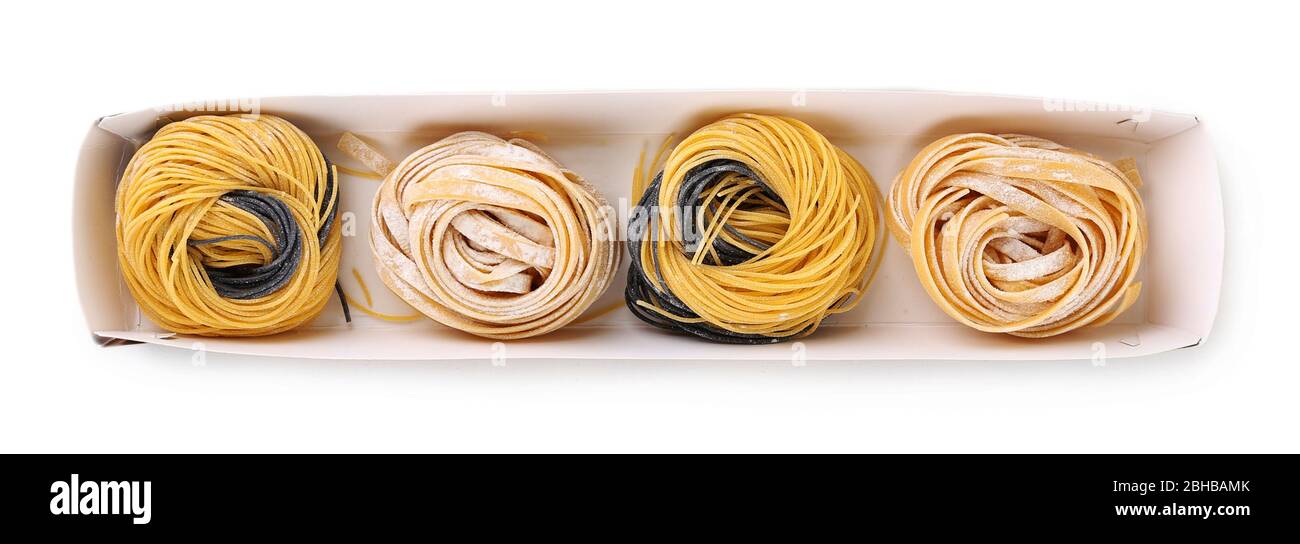 Packaged pasta tagliatelle nests isolated on white Stock Photo - Alamy