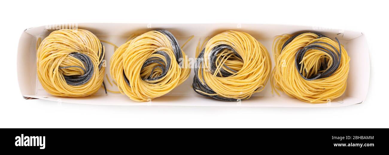 Packaged pasta tagliatelle nests isolated on white Stock Photo - Alamy