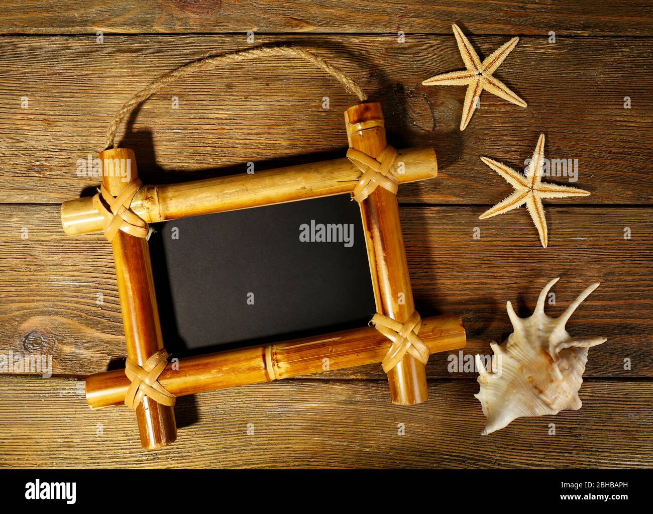 Sign board with shell and sea stars on wooden background Stock Photo ...