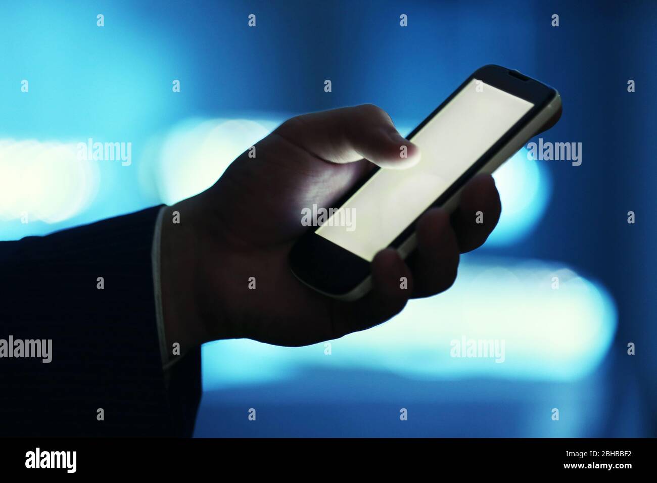 Male hand touching screen phone close-up Stock Photo - Alamy