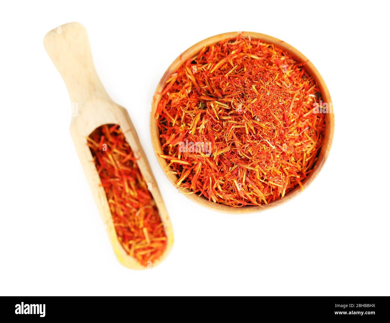 Saffron in wooden bowl, isolated on white Stock Photo - Alamy