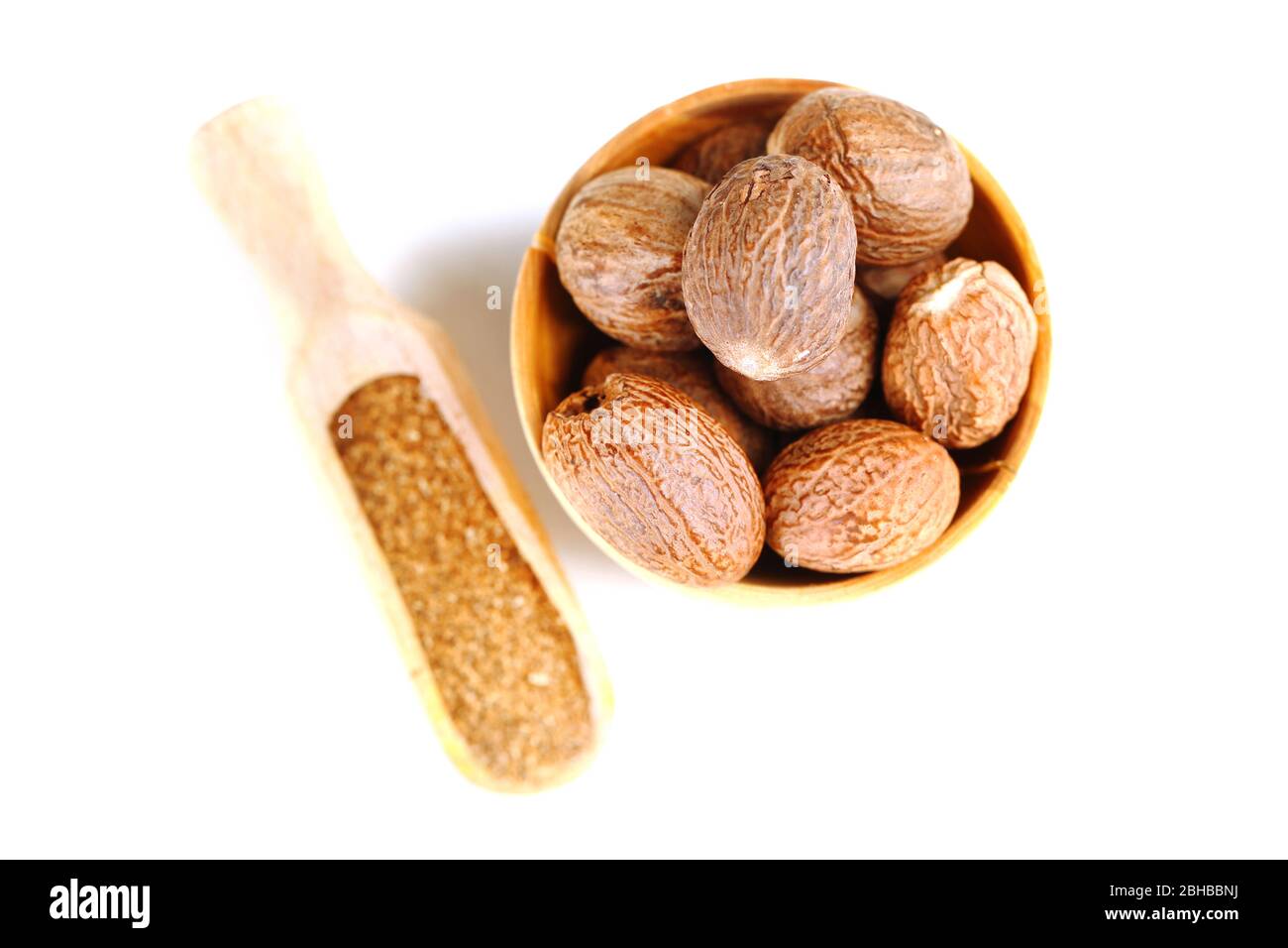Nutmeg in wooden bowl hi-res stock photography and images - Alamy