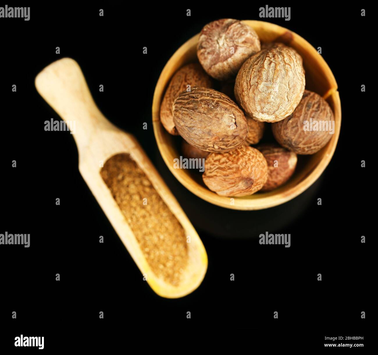 Nutmeg in wooden bowl hi-res stock photography and images - Alamy
