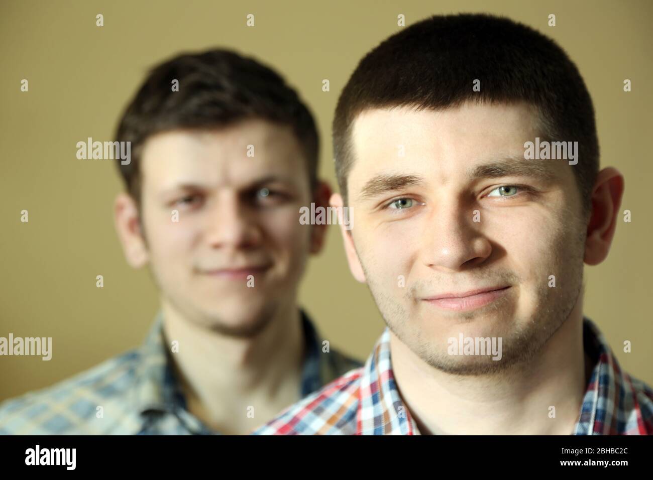 Two handsome young men close up Stock Photo - Alamy