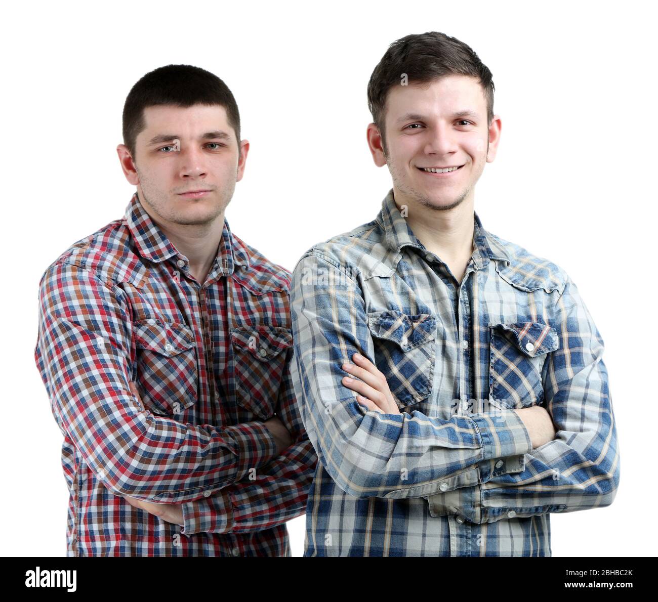 Two handsome young men isolated on white Stock Photo - Alamy