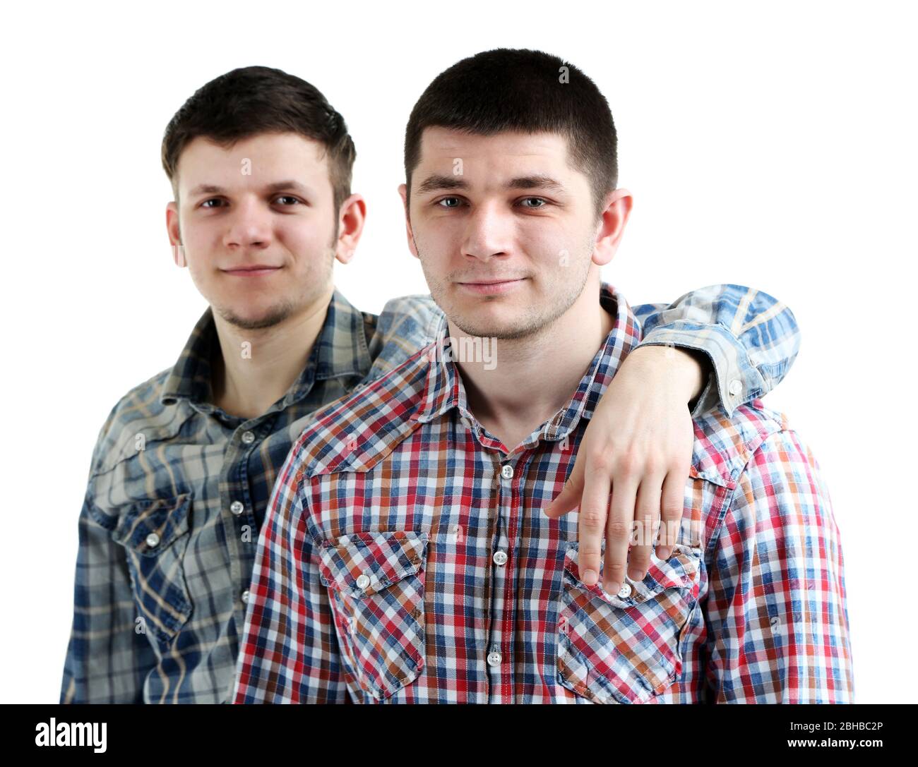 Two handsome young men isolated on white Stock Photo - Alamy