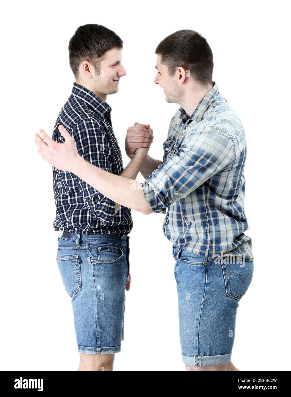 Two handsome young men isolated on white Stock Photo - Alamy