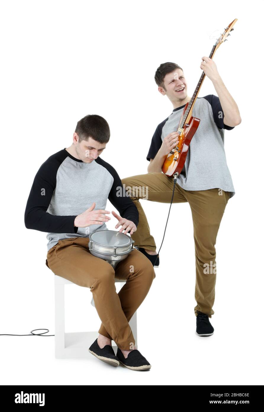 Two handsome young men with musical instruments isolated on white Stock ...