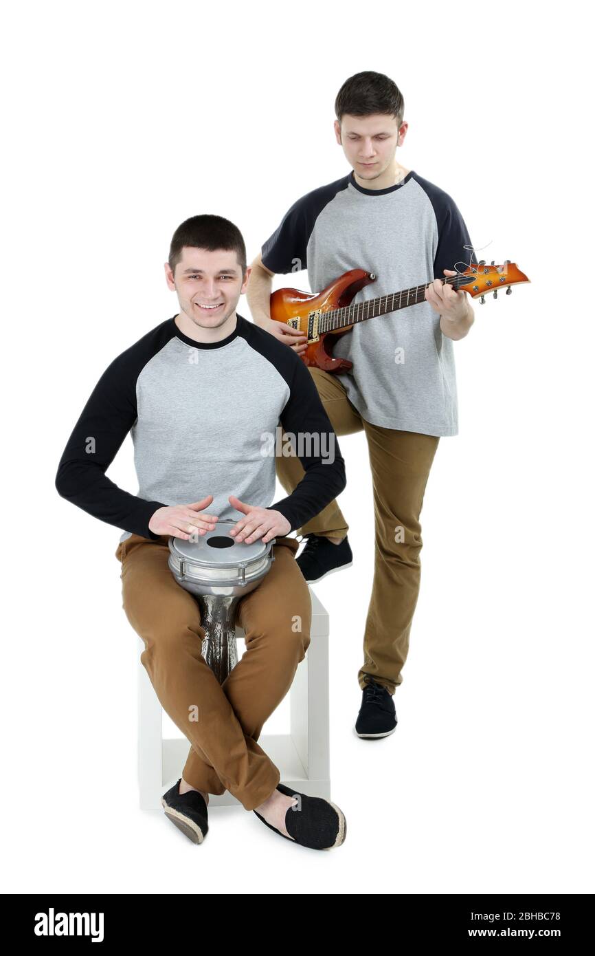 Two handsome young men with musical instruments isolated on white Stock ...