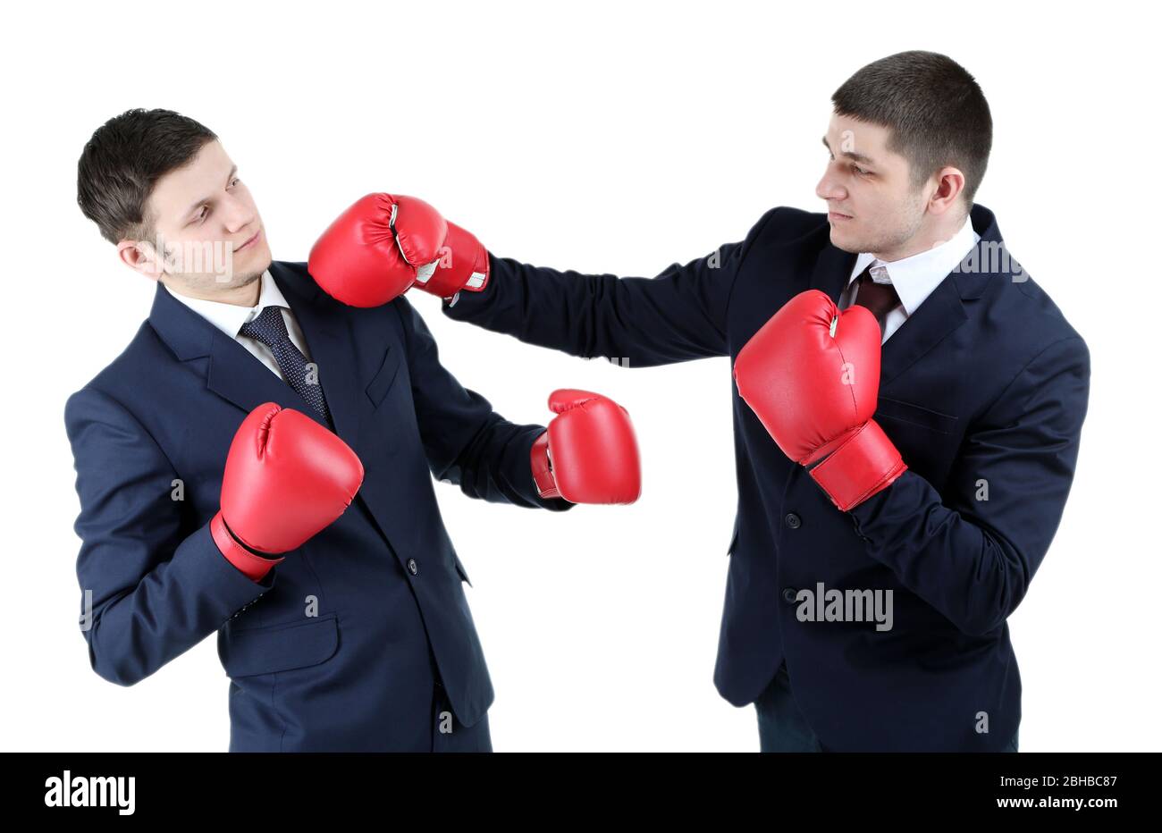 Two handsome businessmen with boxing gloves isolated on white Stock ...