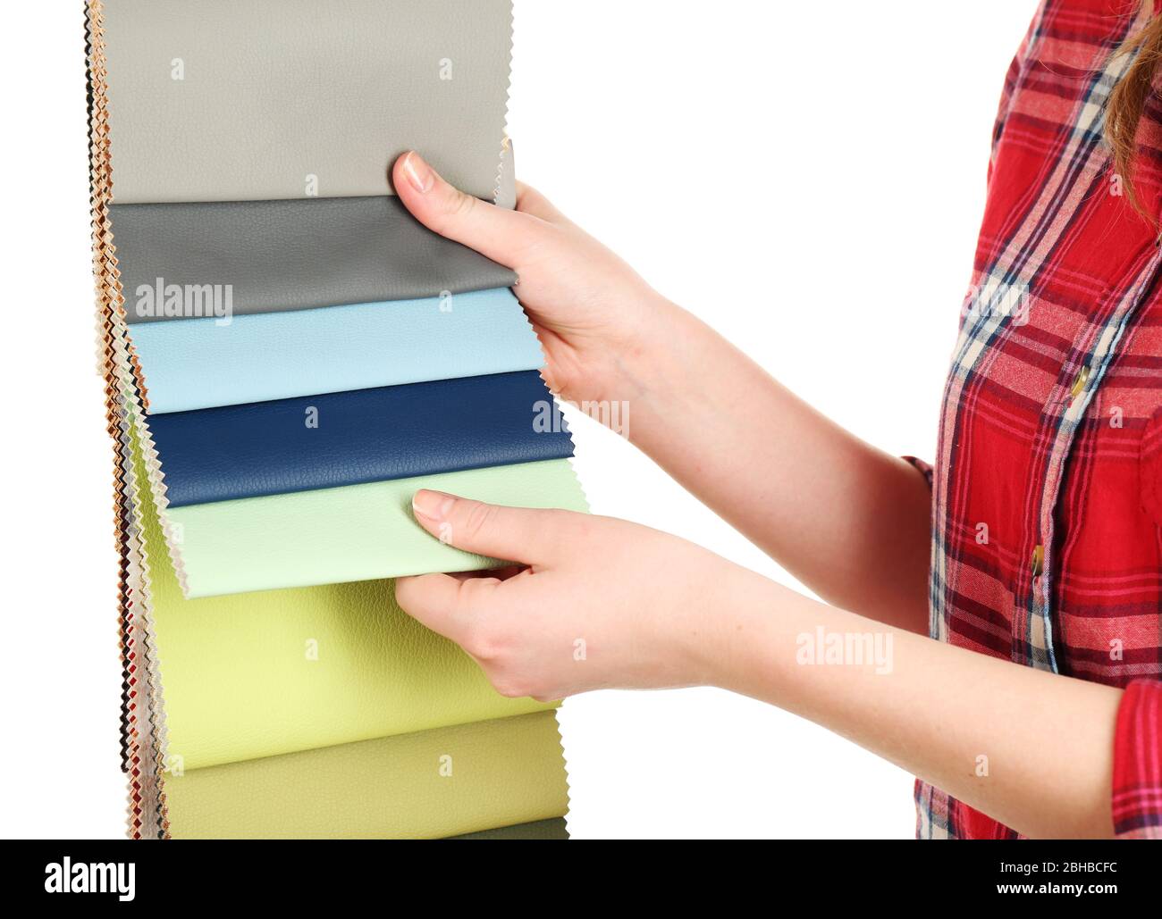 Female hand holding scraps of colored tissue isolated on white Stock ...