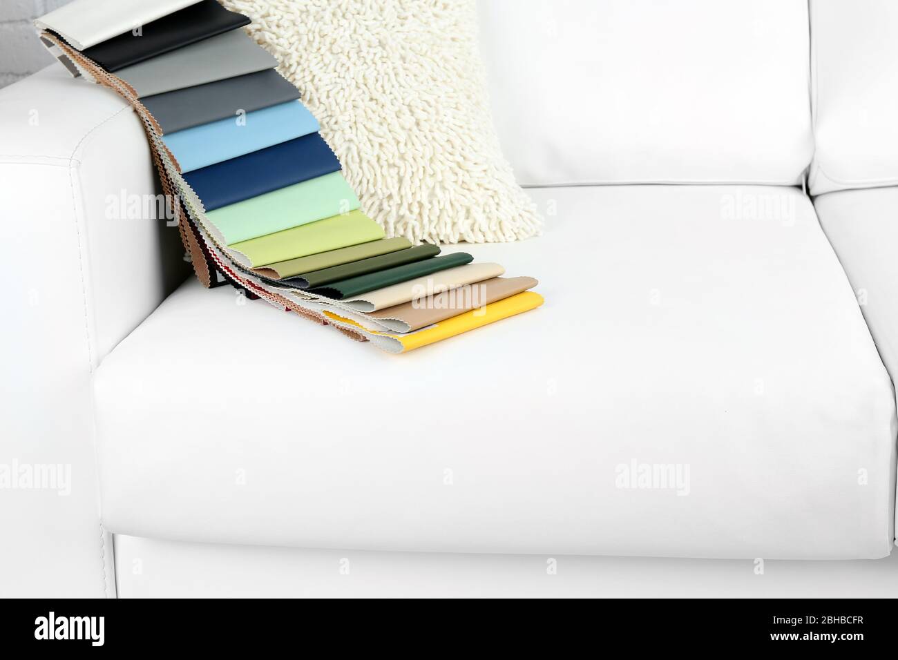 Scraps of colored tissue on sofa close up Stock Photo - Alamy