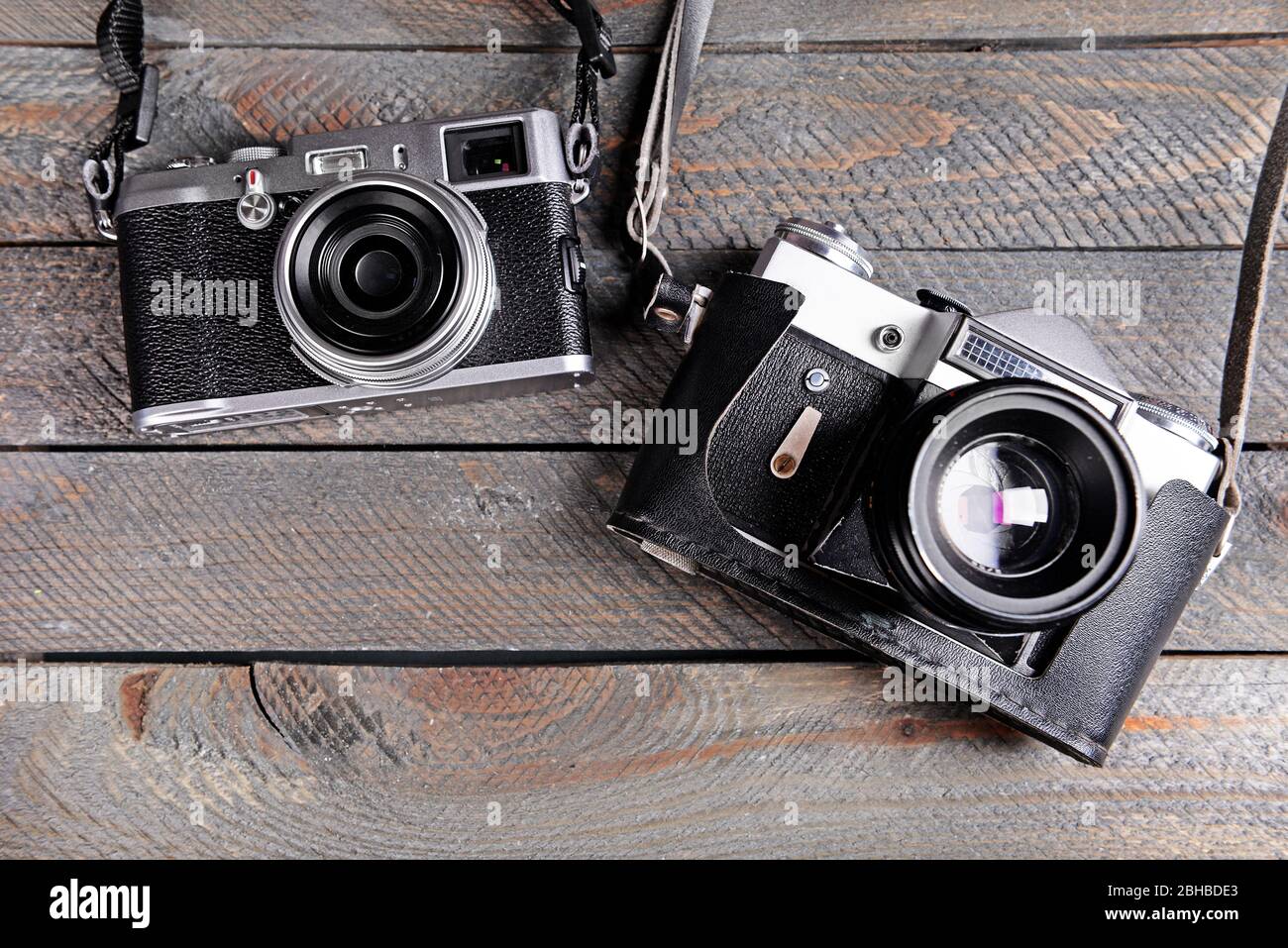 Old retro cameras on rustic wooden planks background Stock Photo - Alamy
