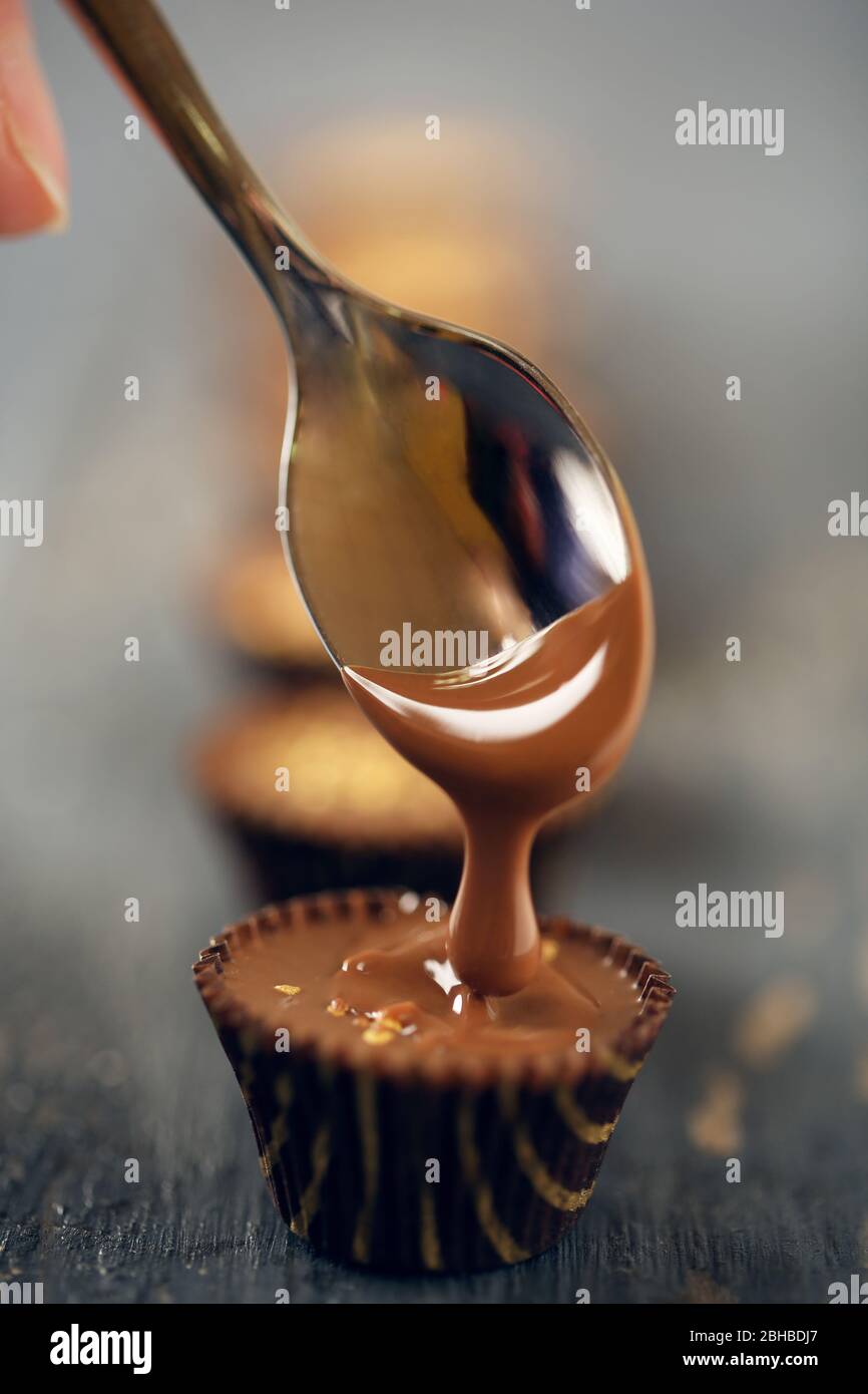 Preparation handmade chocolate candies, close up Stock Photo - Alamy