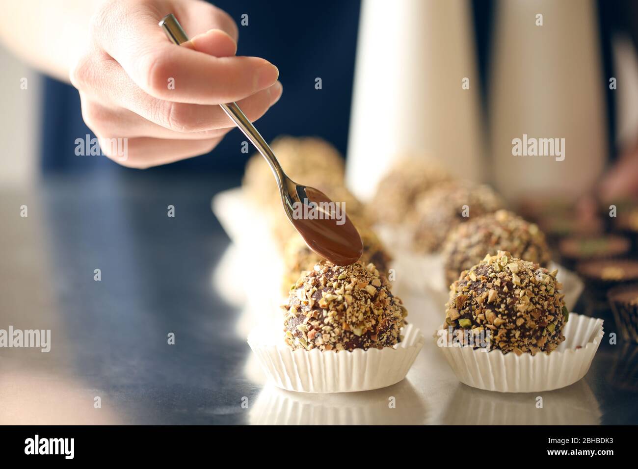 Female chocolatier making chocolate close hi-res stock photography and ...