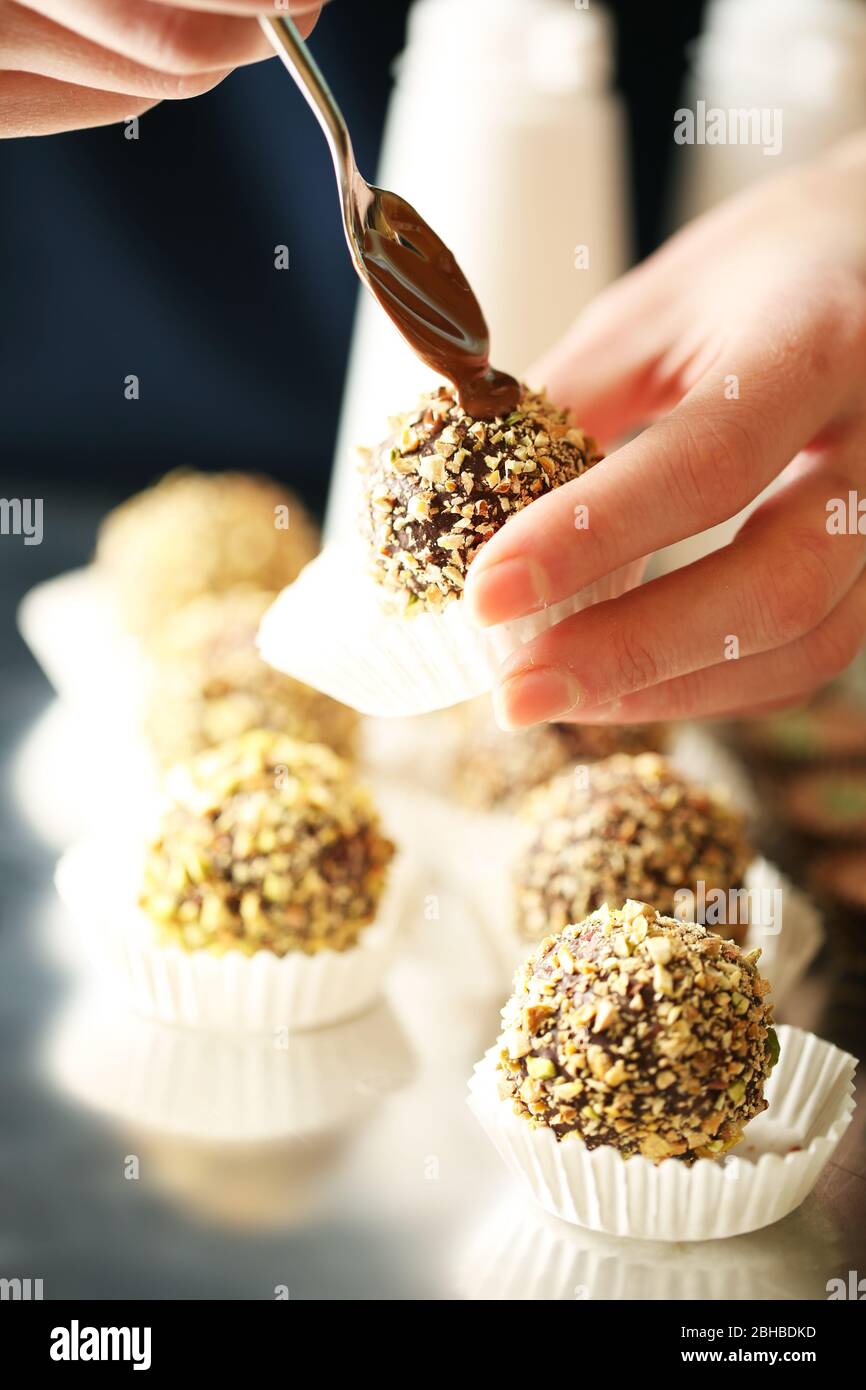 Female chocolatier making chocolate close hi-res stock photography and ...